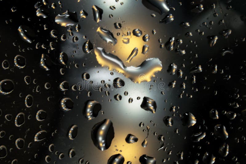 Drops of Water on the Glass and the Play of Light and Shadow. Stock ...