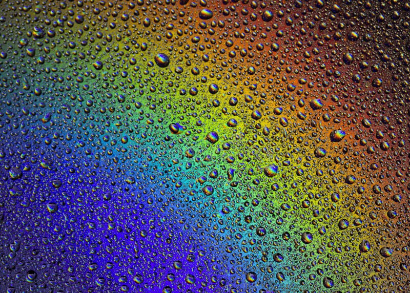 Drops of Water on the Glass, with the Reflection of the Rainbow Stock ...