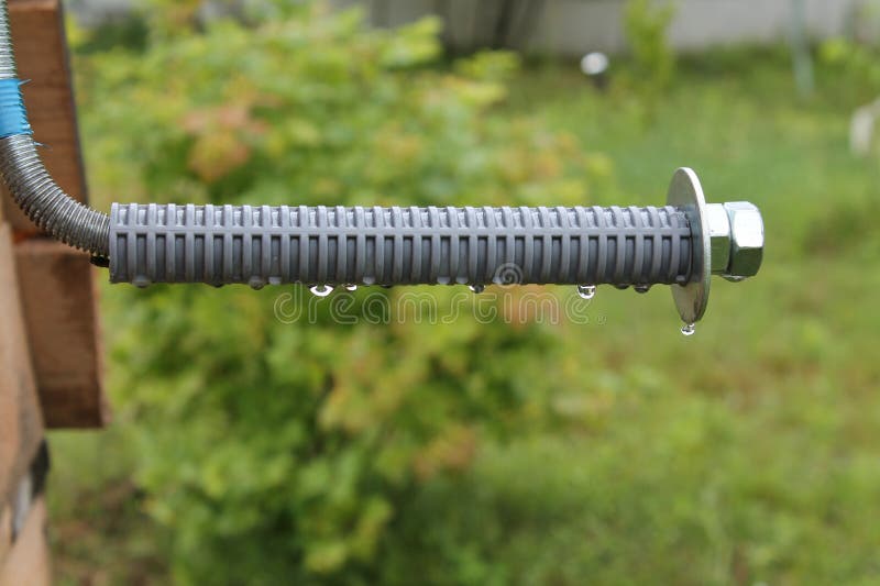 Drops of Water on the Handle of a Well after Rain Stock Photo - Image ...