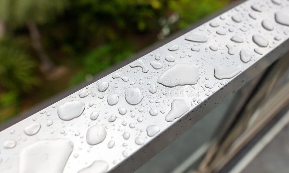 Drops of Water from Rain on a Metal Railing Stock Image - Image of ...