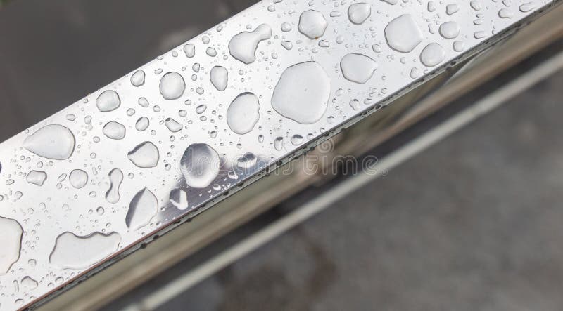 Drops of Water from Rain on a Metal Railing Stock Image - Image of ...
