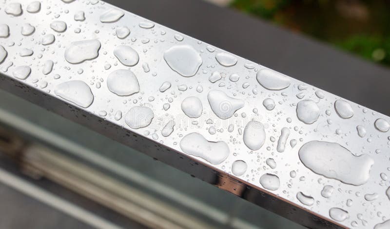 Drops of Water from Rain on a Metal Railing Stock Photo - Image of ...