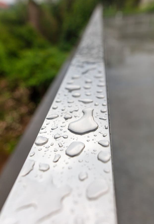 Drops of Water from Rain on a Metal Railing Stock Photo - Image of ...