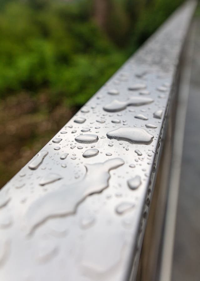 Drops of Water from Rain on a Metal Railing Stock Image - Image of ...