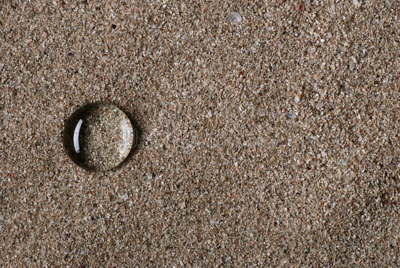 Drops of water on the sand stock image. Image of circle - 40918837