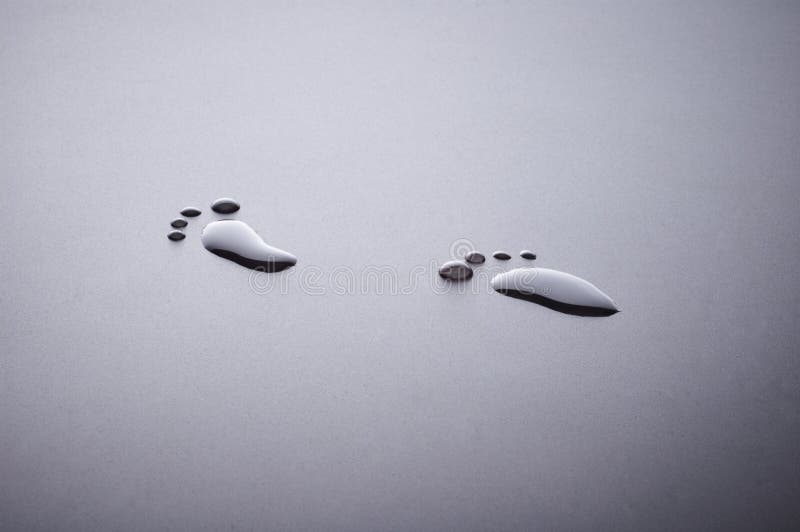 Drops of Water Splashed in the Form of Traces of Human Feet Stock Image ...
