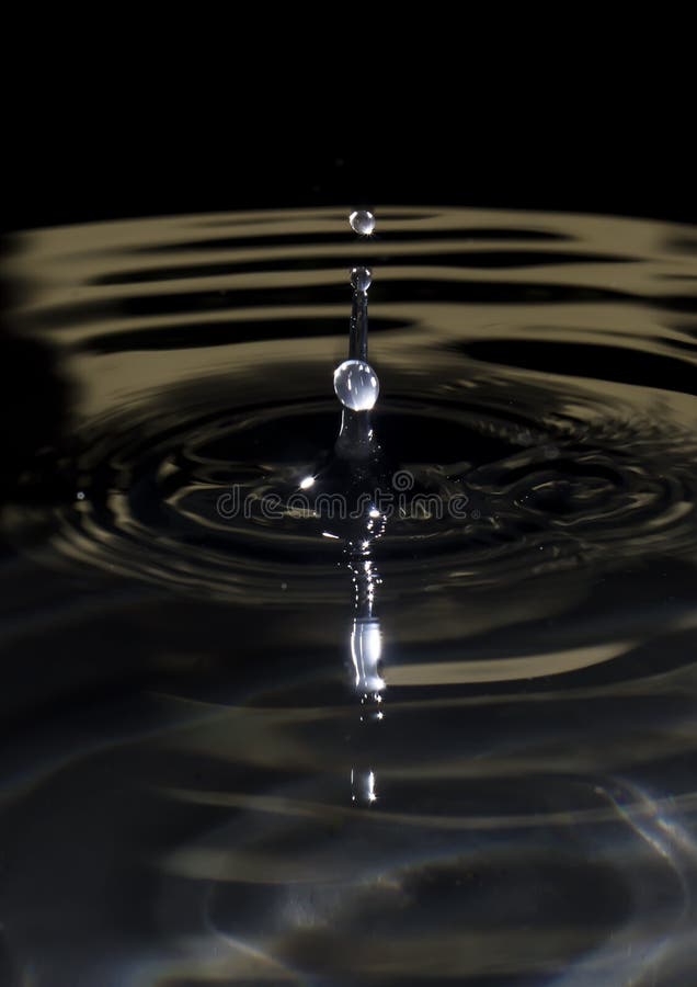 Drops of Water on the Surface of the Water Spreading and Forming Waves ...