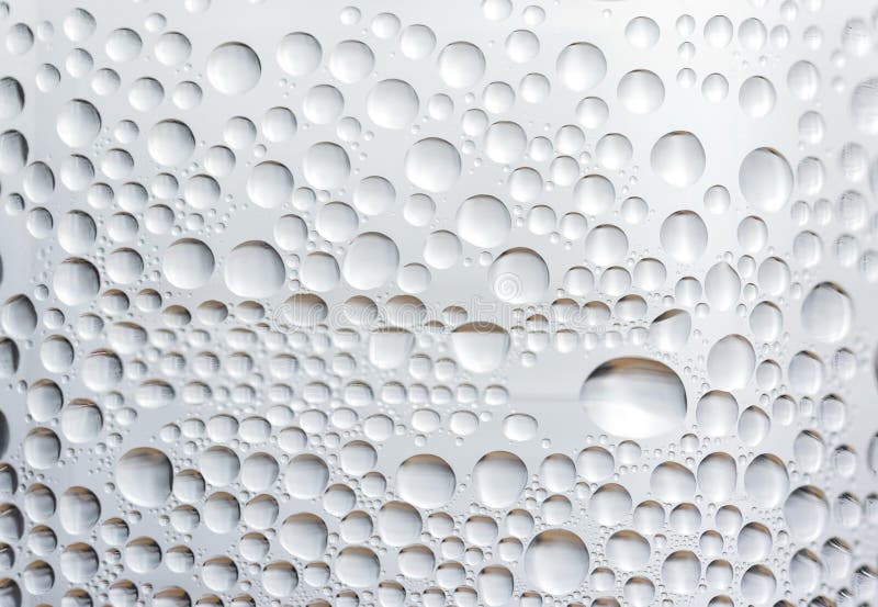 Drops of water white color stock image. Image of illuminated - 76927011