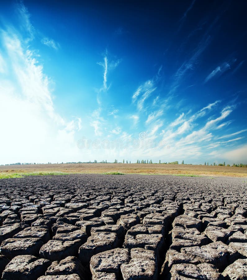 Drought Earth Closeup and Deep Blue Sky with Clouds Stock Photo - Image ...
