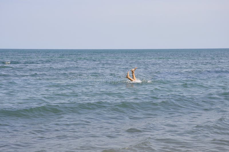 Drowning men in the sea stock photo. Image of nature - 97373924