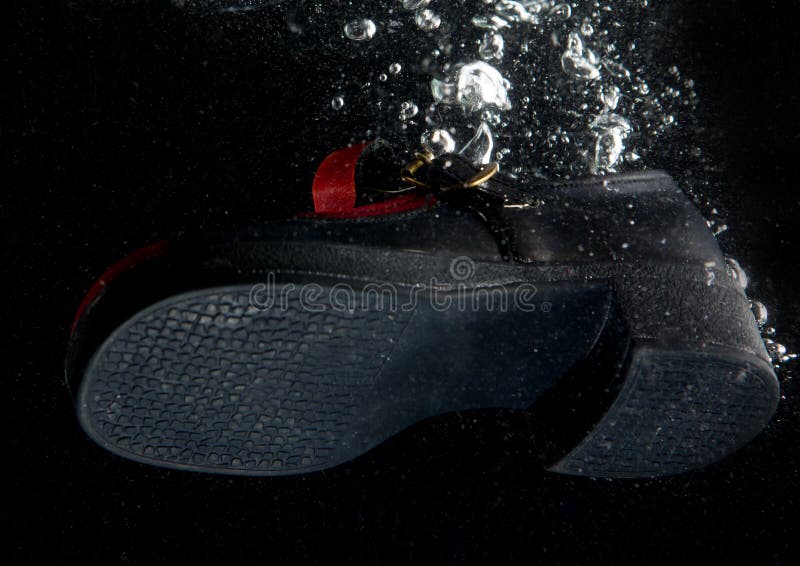 Drowning shoe - sinking. stock image. Image of ocean - 122551607