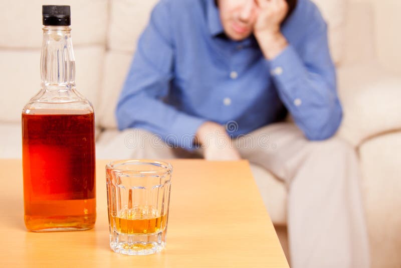 Drowning Sorrows in Alcohol Stock Photo - Image of blue, alcohol: 20303538