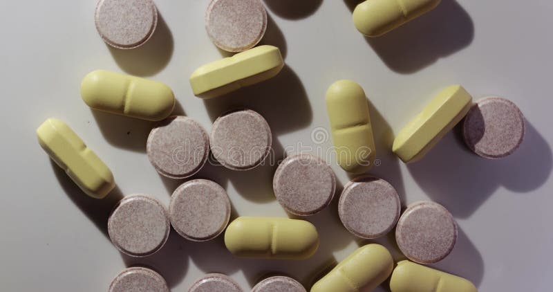Drug Pills Spinning on a Glowing Tray Stock Footage - Video of drugs ...