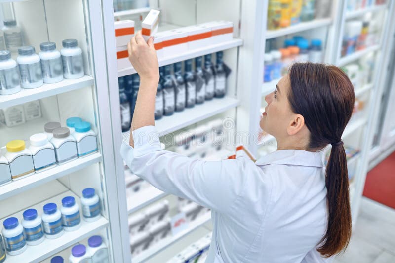 Female Pharmacist Working in the Drugstore Stock Image - Image of ...