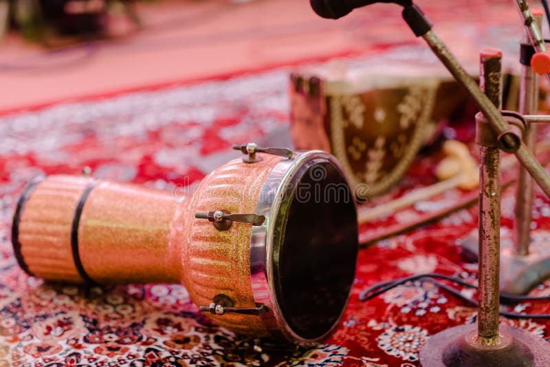 Drum Set on the Floor with a Microphone and Other Music Instruments in ...