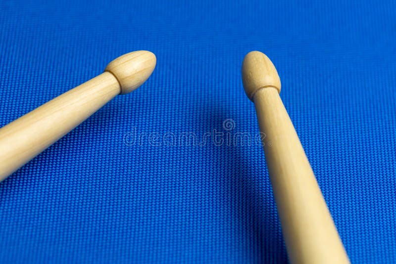 Drum Sticks on a Blue Background Stock Image - Image of band, musical ...