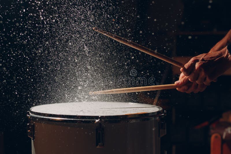 Drum Sticks Drumming Beat Rhythm on Drum Surface with Splash Water ...