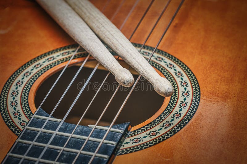 Drum Sticks on Guitar Strings Stock Image - Image of music, playing ...
