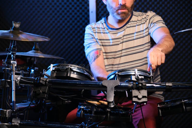 Drummer Man Adjusting a Drum in a Drum Set in a Recording Studio. Stock ...