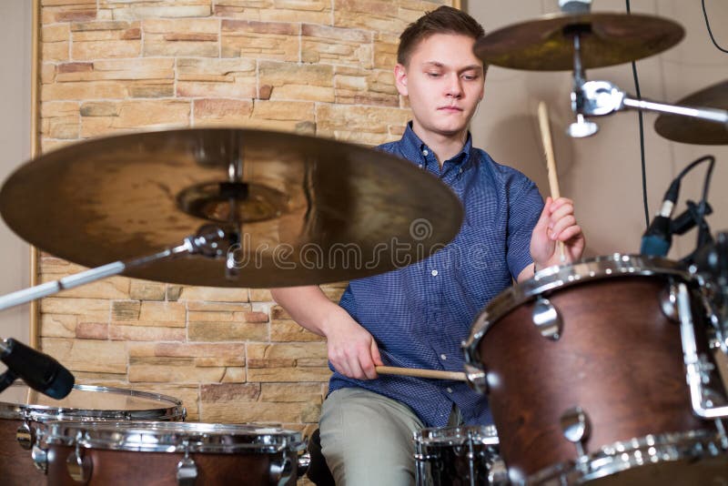 Drummer Plays the Drum Kit in the Studio Stock Photo - Image of hair ...