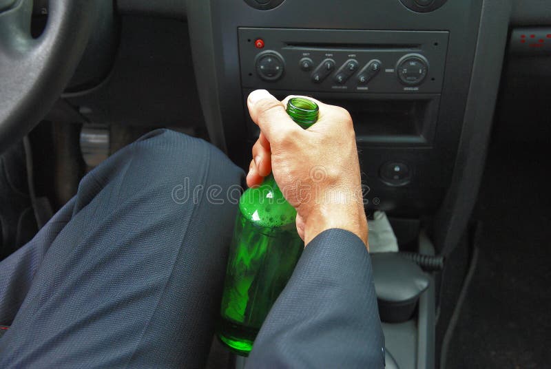 Drunk driver with bottle stock photo. Image of drive - 58240486