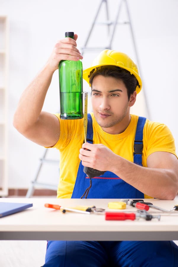 The Drunk Engineer Working in the Workshop Stock Photo - Image of ...