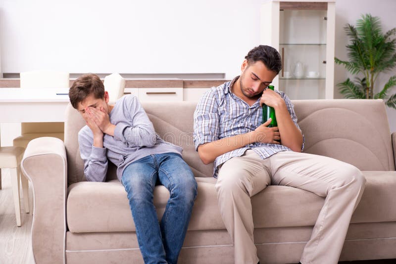 Drunk father and his son stock photo. Image of abuse - 156417846