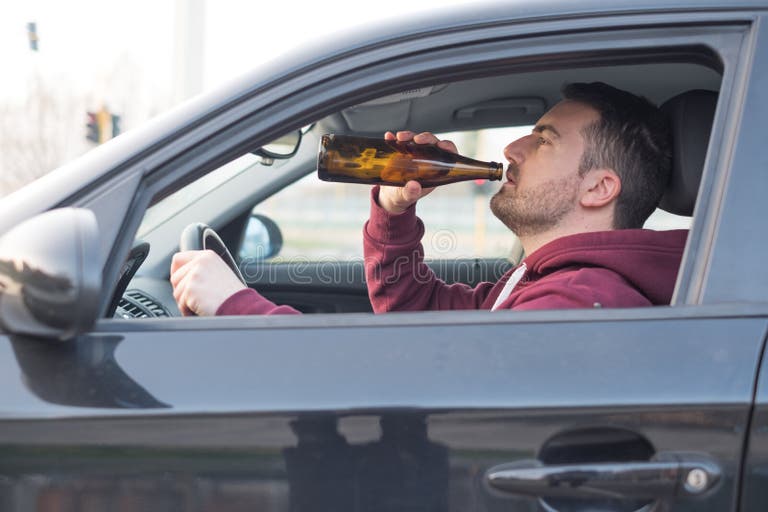 Drunk Man Driving His Car and Drinking Stock Photo - Image of attention ...