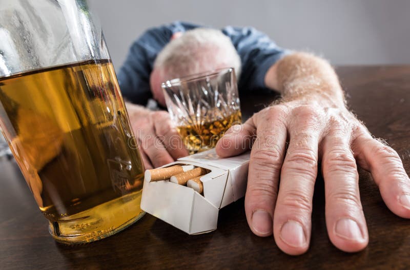 Drunk man slumped on table stock image. Image of whiskey - 60421667