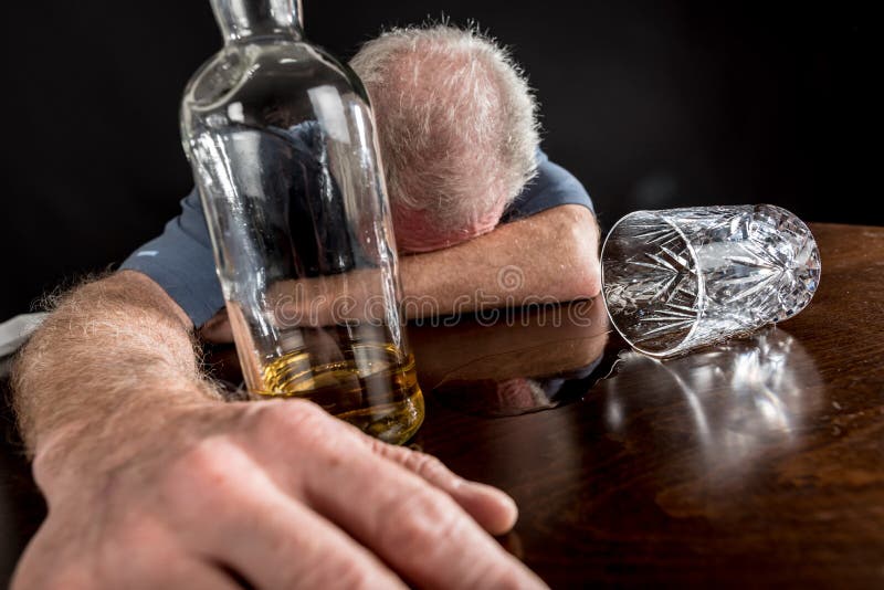 Drunk man slumped on table stock image. Image of person - 66169797