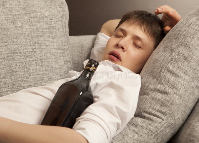 Drunkard. a Young Man with a Drinking Problem is Relaxing Stock Image ...