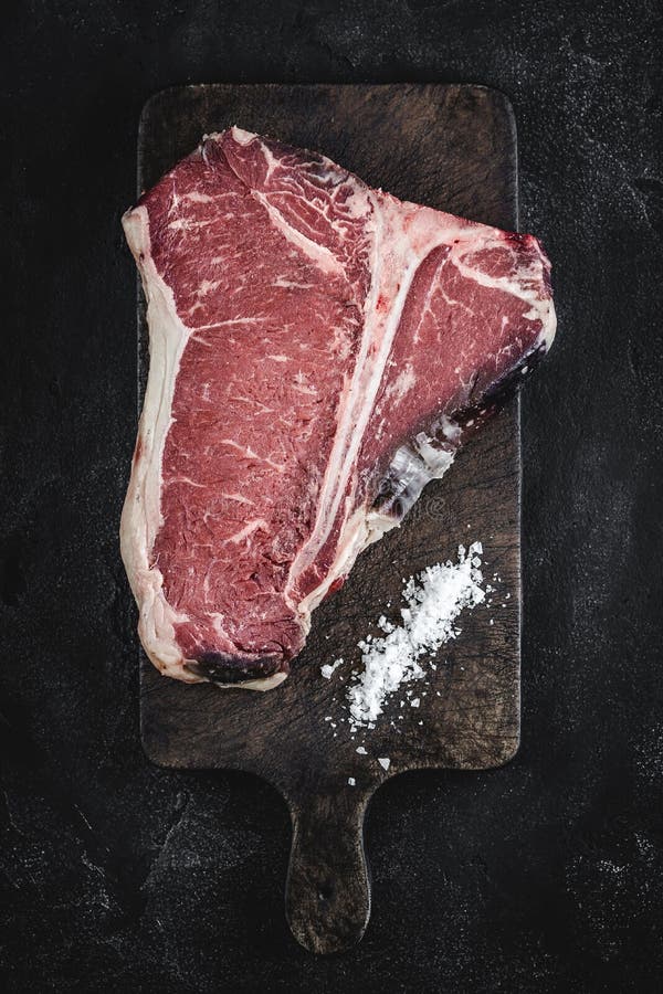 Dry Aged Beef Raw T-bone Steak on Vintage Cutting Board Stock Image ...