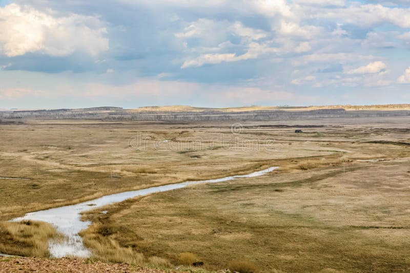 A Dry, Barren Landscape with a River Running through it Stock Image ...