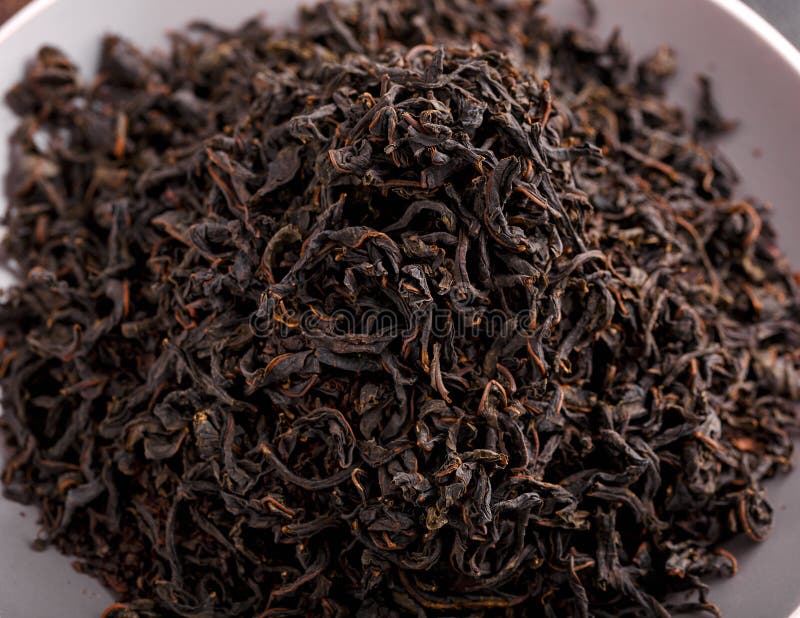 Dry Black Large Leaf Tea on Plate. Stock Photo - Image of scattered ...