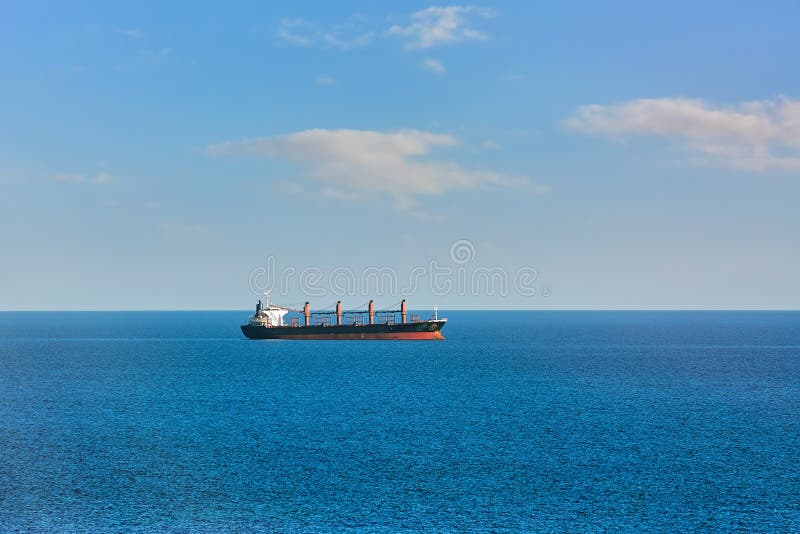 Dry-cargo Ship in the Sea stock photo. Image of main - 104954626