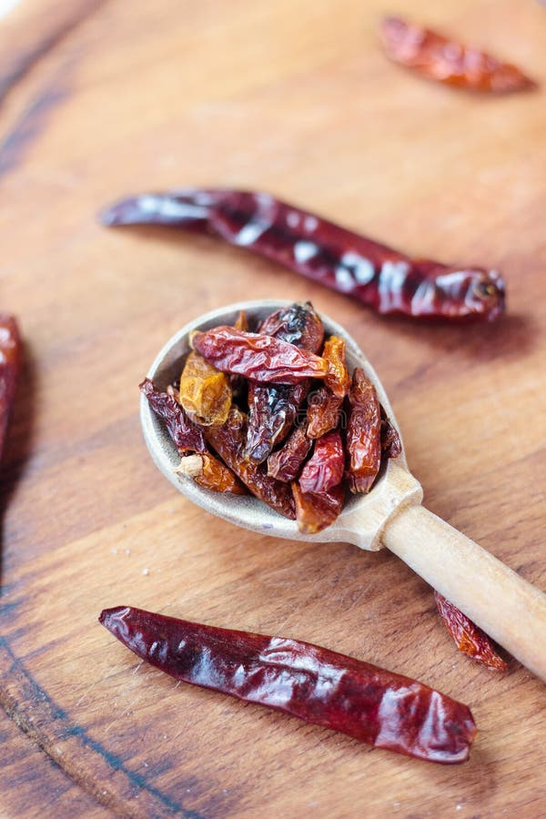 Dry Chili Pepper Spice in a Wooden Spoon on Board. Stock Image - Image ...