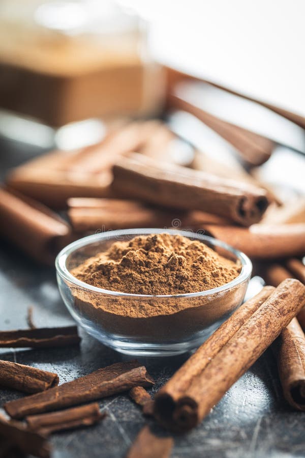 Dry Cinnamon Sticks and Cinnamon Powder on Kitchen Table. Cinnamon ...