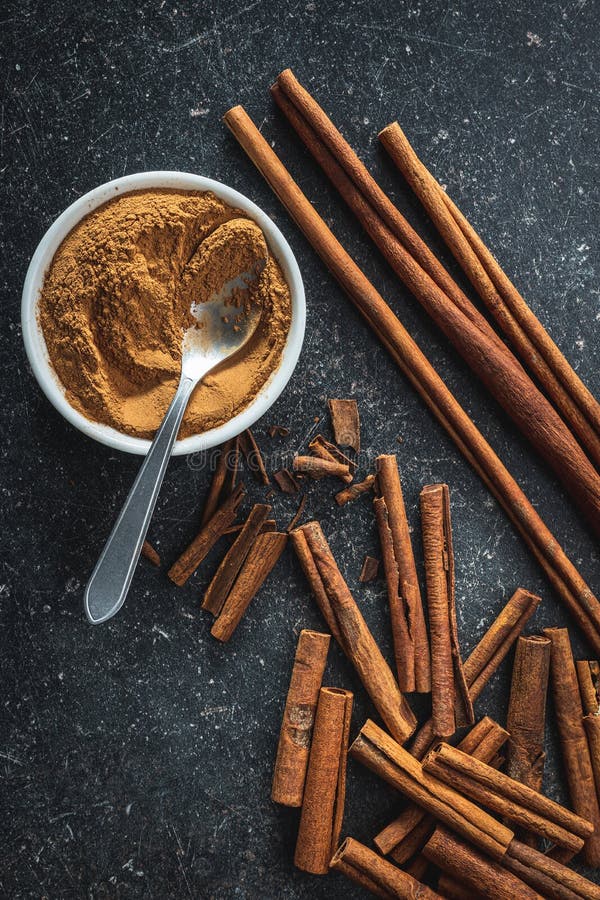 Dry Cinnamon Sticks and Cinnamon Powder on Kitchen Table. Cinnamon ...