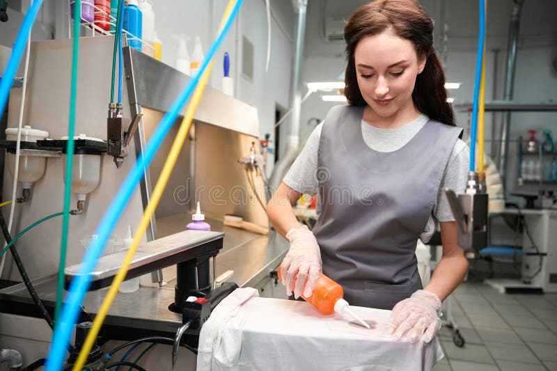 Dry-cleaning Operator Adding Solvent To Spots, Treating Clothes before ...