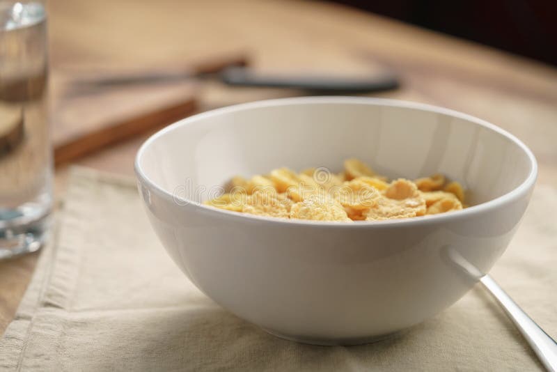 Dry Corn Flakes for Breakfast in Bowl on Table Stock Image - Image of ...