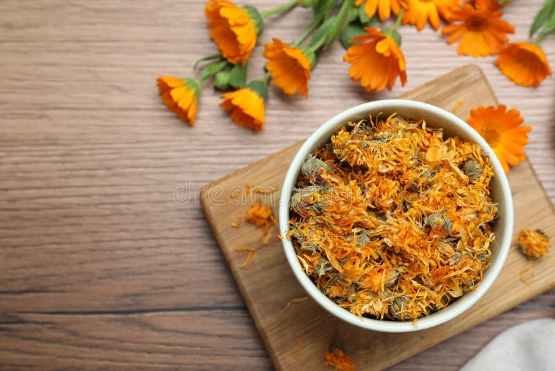 Dry and Fresh Calendula Flowers on Wooden Table, Flat Lay. Space for ...