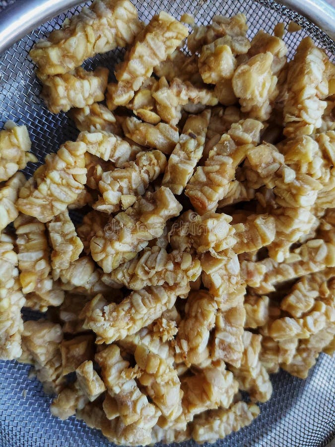 Dry Fried Tempeh with a Small Size in a Stainless Sieve Stock Image ...