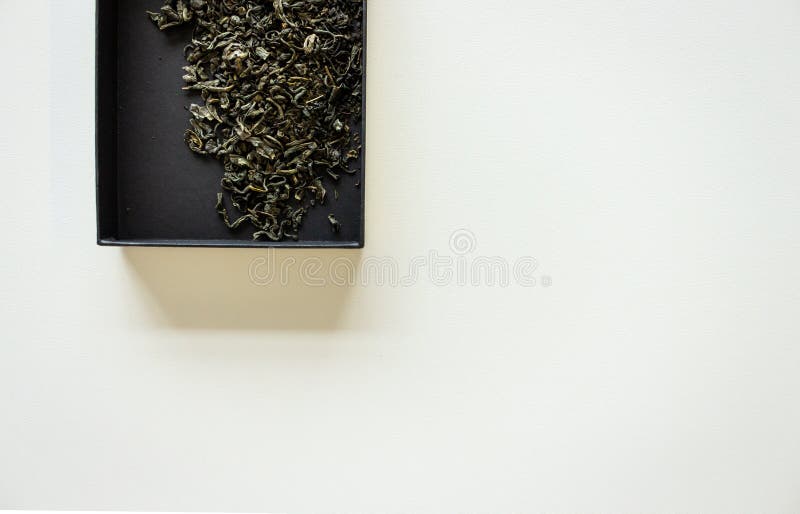 Dry Green Tea Leaves in a Box on a Light Background. Stock Photo ...