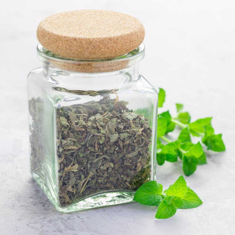 Dry Herbal Mint Tea in a Glass Jar with Fresh Peppermint on Background ...