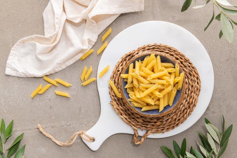Dry Italian Penne Pasta on Kitchen Countertop. Top-view Stock Photo ...