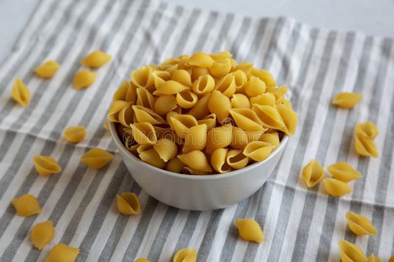 Dry Organic Medium Pasta Shells in a Bowl, Side View Stock Photo ...