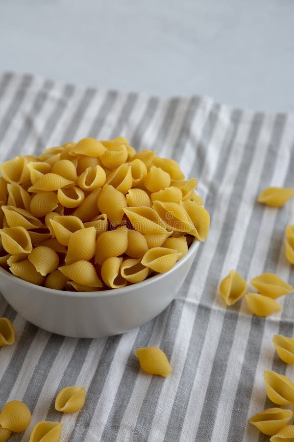 Dry Organic Medium Pasta Shells in a Bowl, Side View Stock Image ...