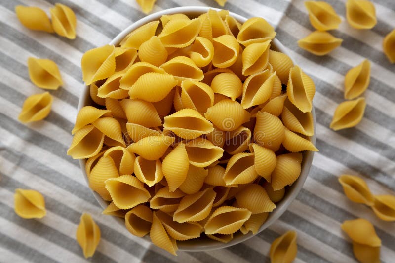 Dry Organic Medium Pasta Shells in a Bowl, Top View. Stock Image ...