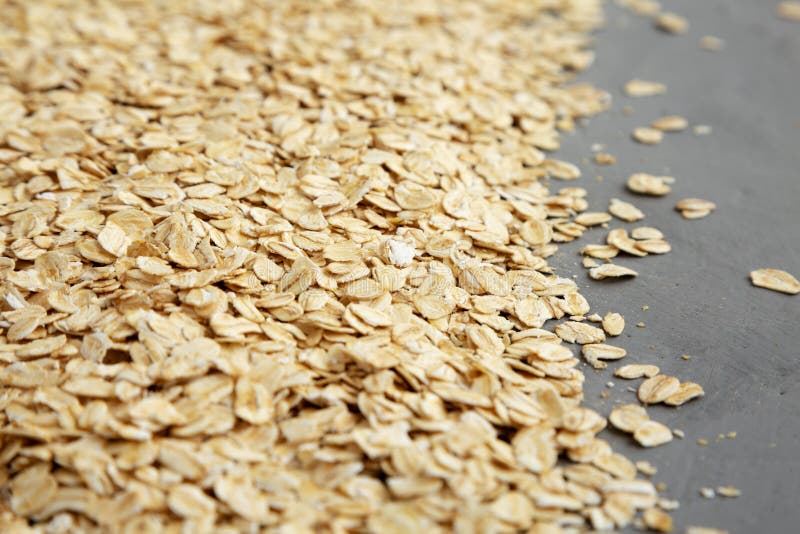 Dry Organic Rolled Oats on a Gray Background, Side View Stock Image ...