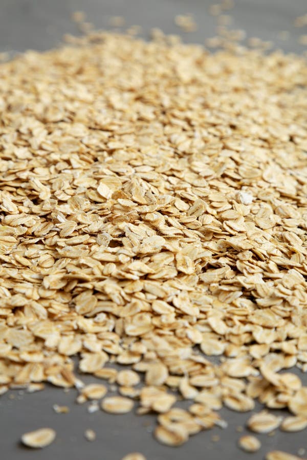Dry Organic Rolled Oats on a Gray Surface, Side View Stock Photo ...